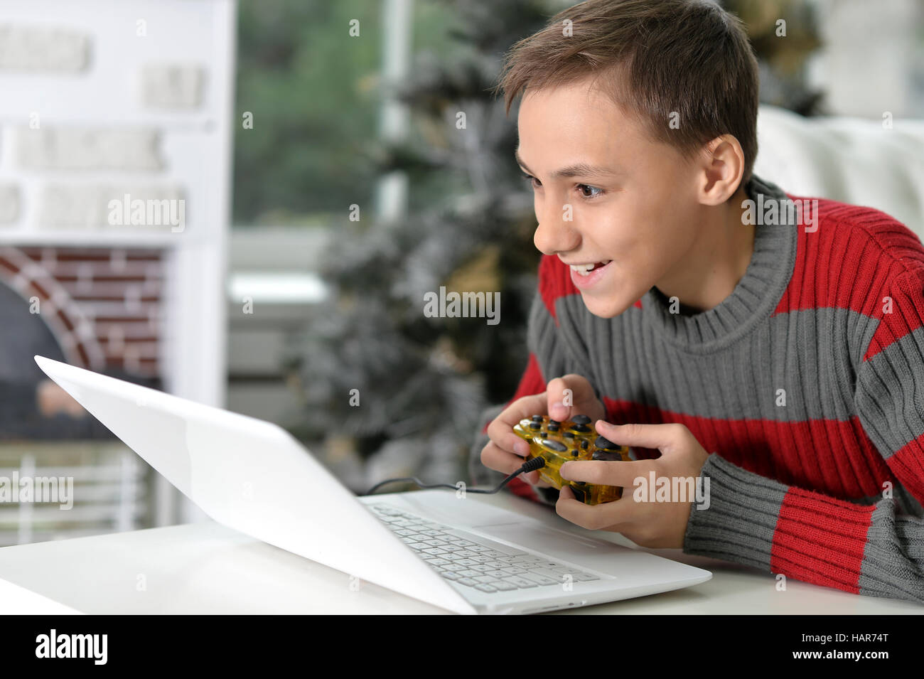 Boy playing video game Stock Photo - Alamy