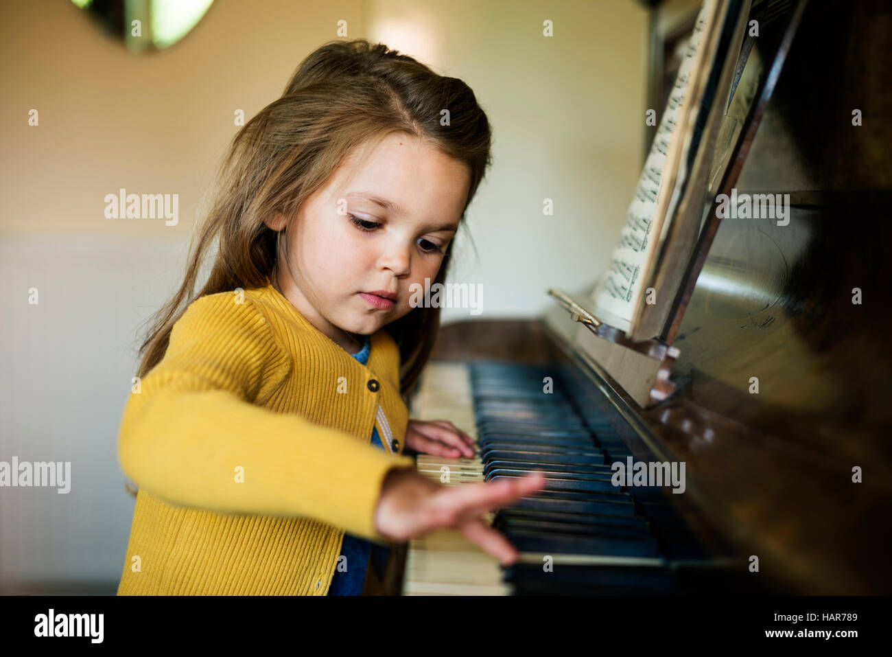 Adorable Cute Girl Playing Piano Concept Stock Photo - Alamy