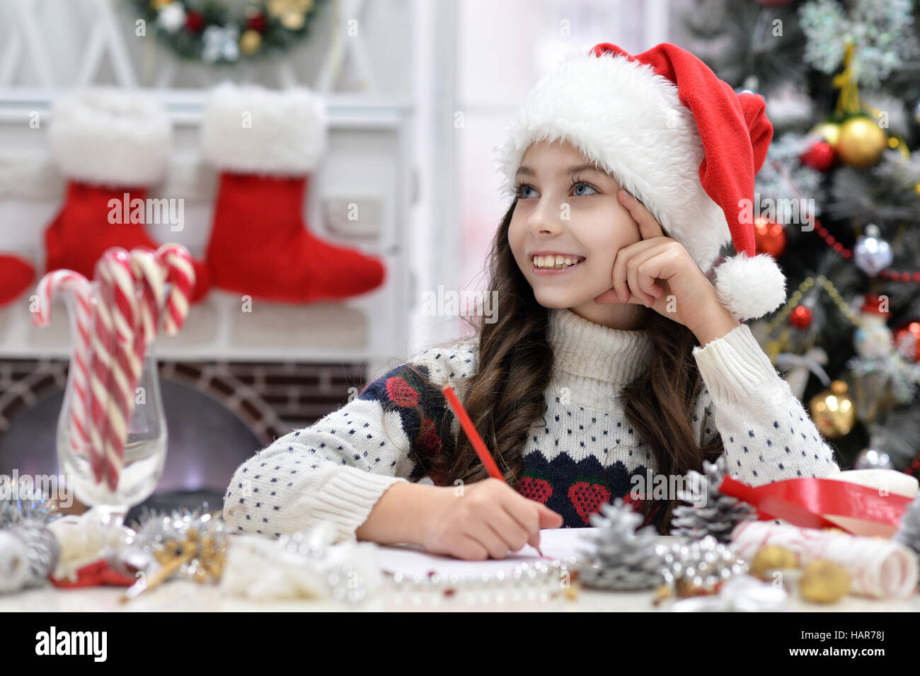 Girl writing letter Stock Photo - Alamy