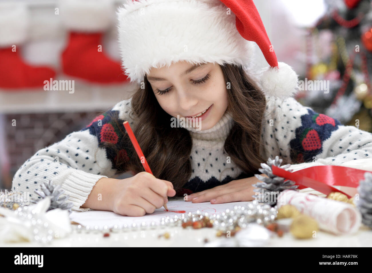 Girl writing letter Stock Photo - Alamy