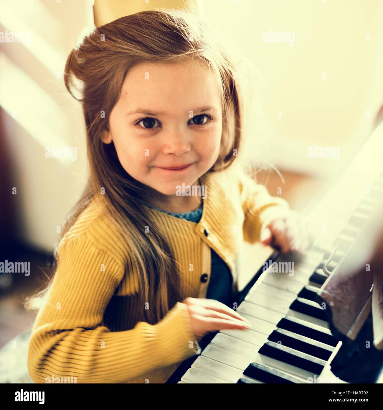 Adorable Cute Girl Playing Piano Concept Stock Photo - Alamy