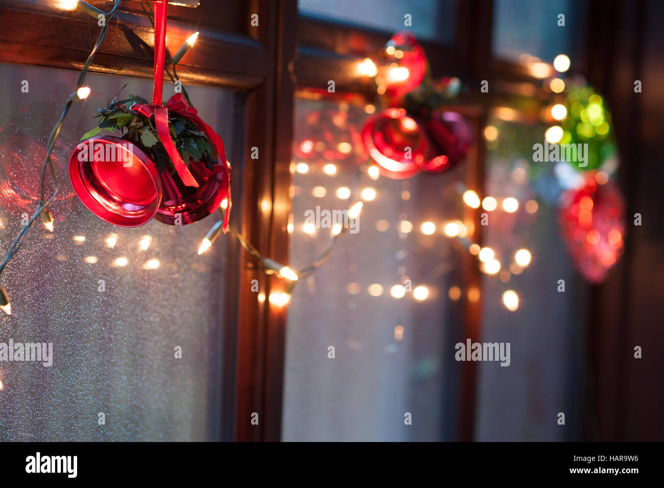 Christmas bells red on window Stock Photo - Alamy