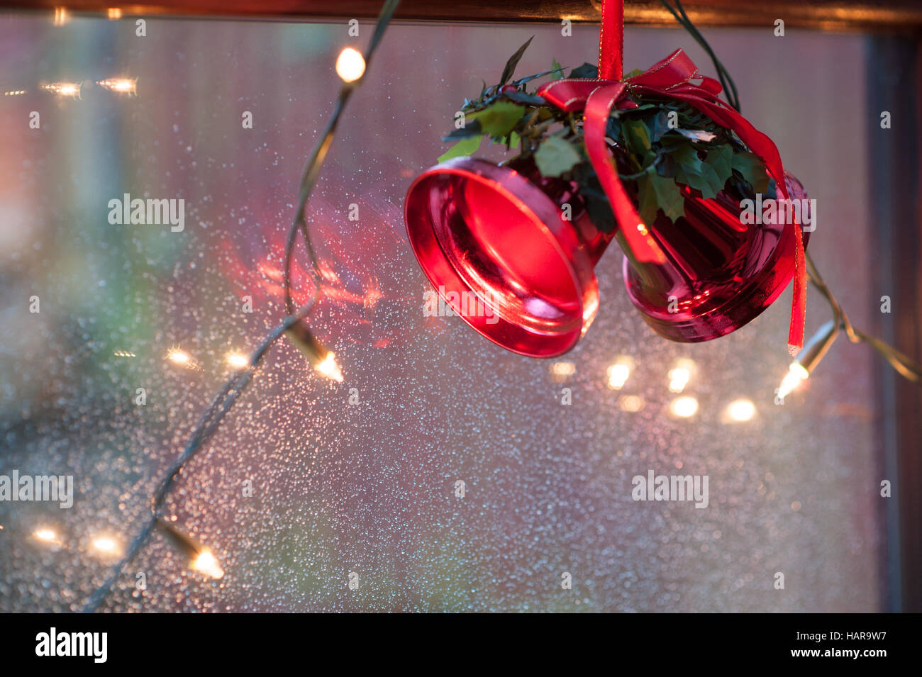 Christmas bells red on window Stock Photo - Alamy