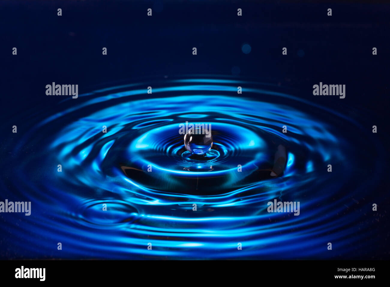 Water drop on surface Stock Photo - Alamy