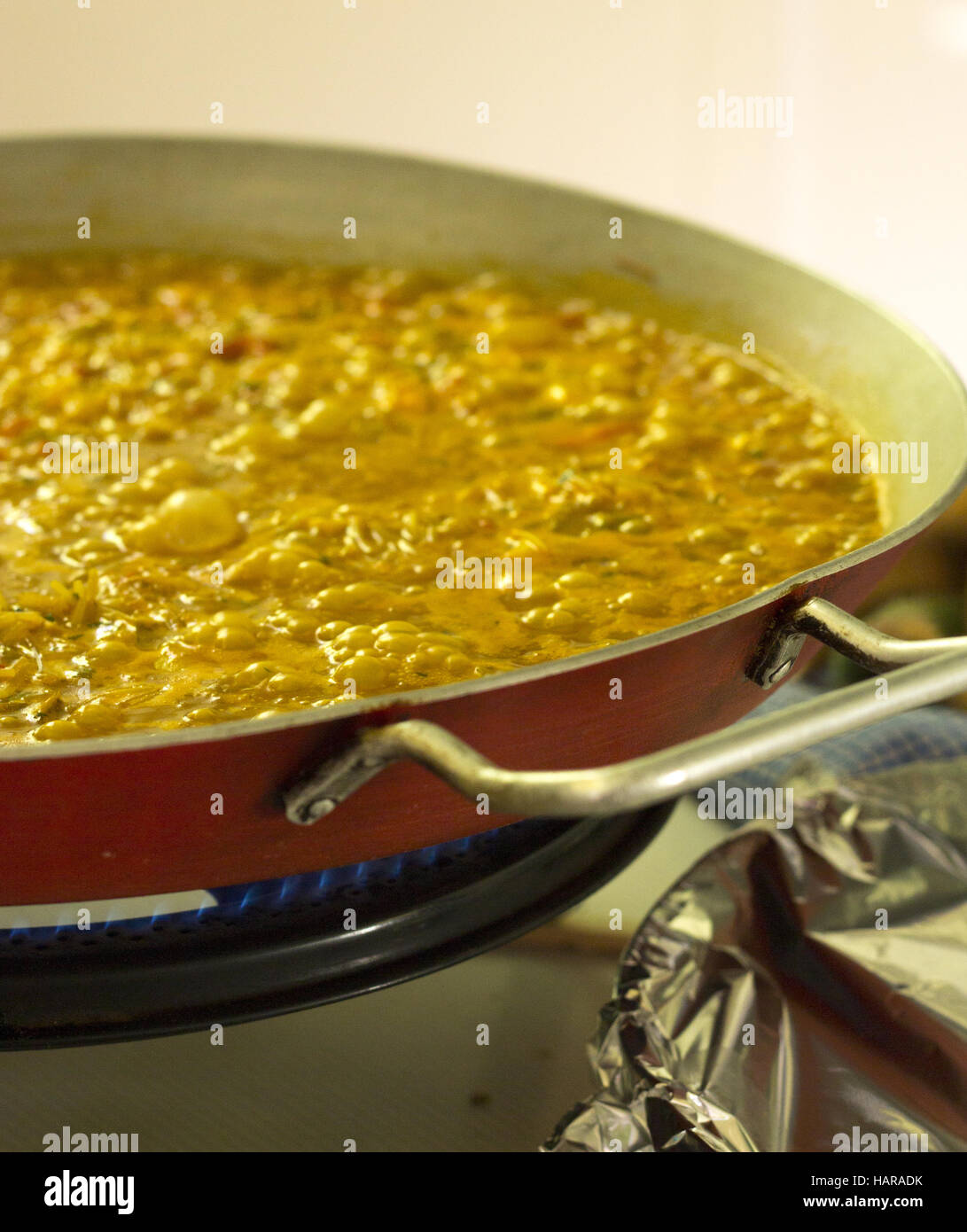 Seafood fideuá finishing cooking Stock Photo - Alamy