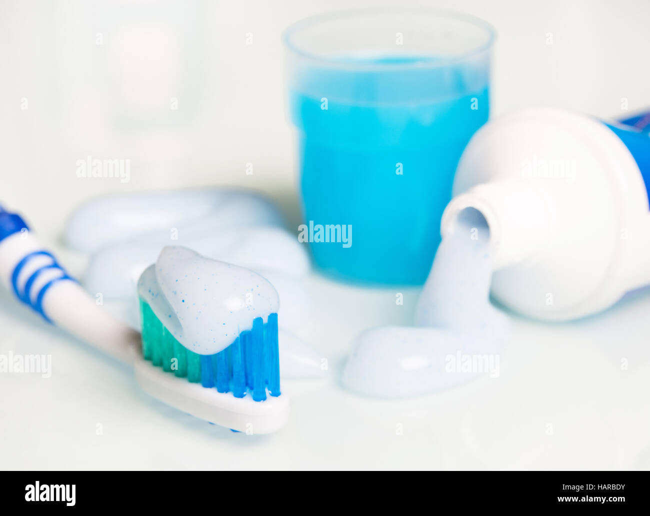 blue toothbrush with mouthwash and toothpaste Stock Photo - Alamy