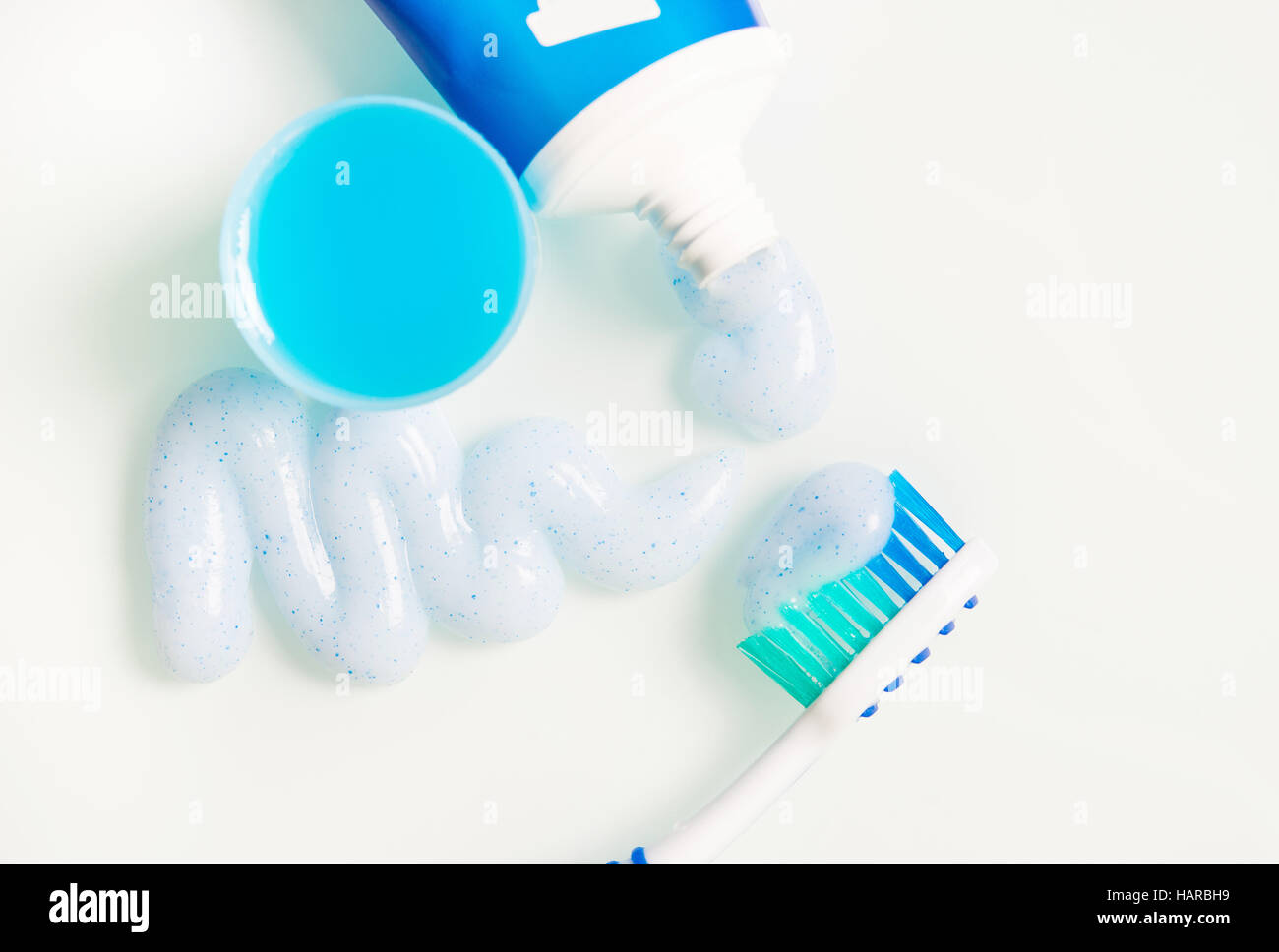 toothbrush with mouthwash and toothpaste Stock Photo - Alamy