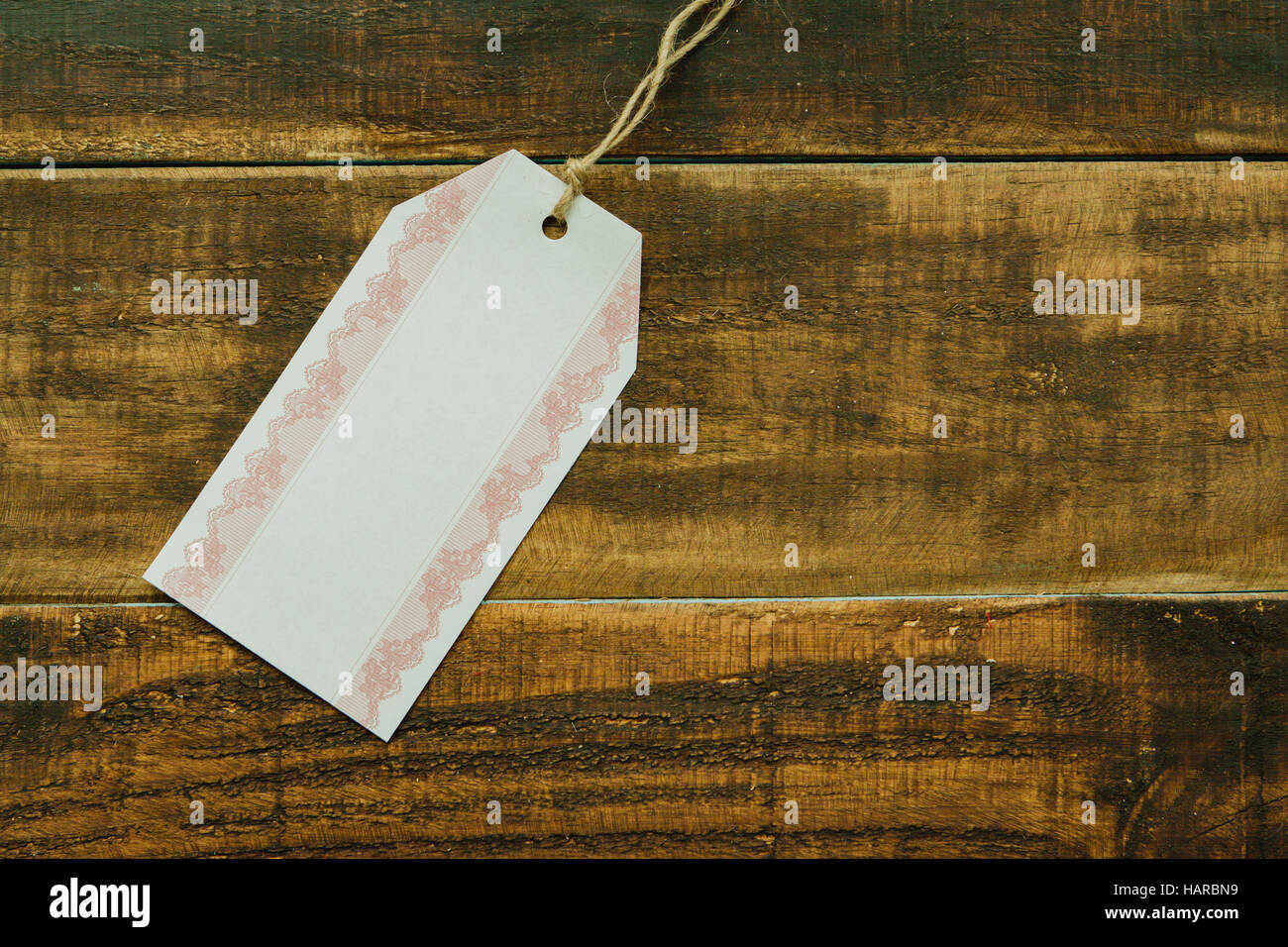 Empty shopping tag template on a rustic wood background Stock Photo - Alamy