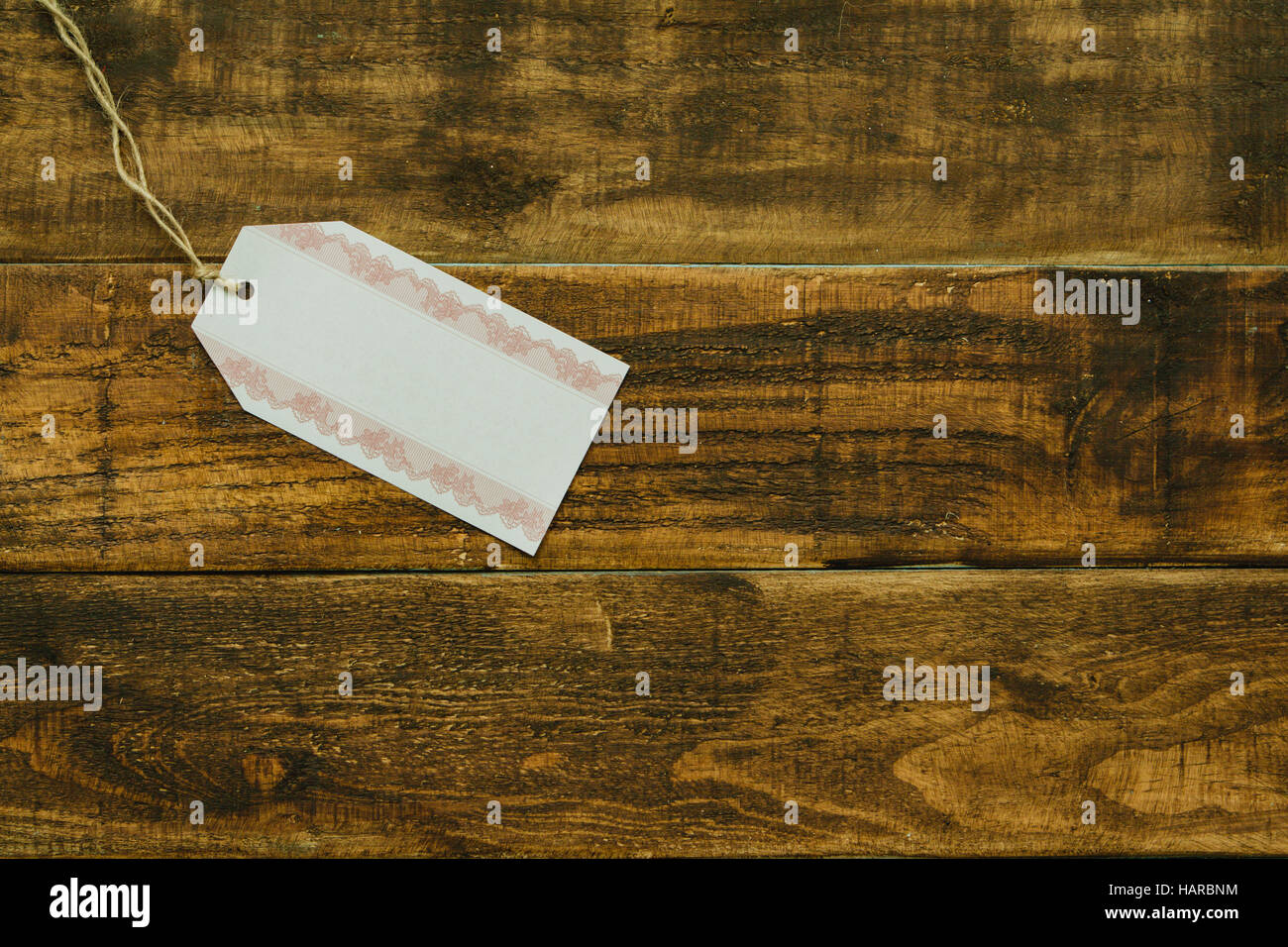 Empty shopping tag template on a rustic wood background Stock Photo - Alamy