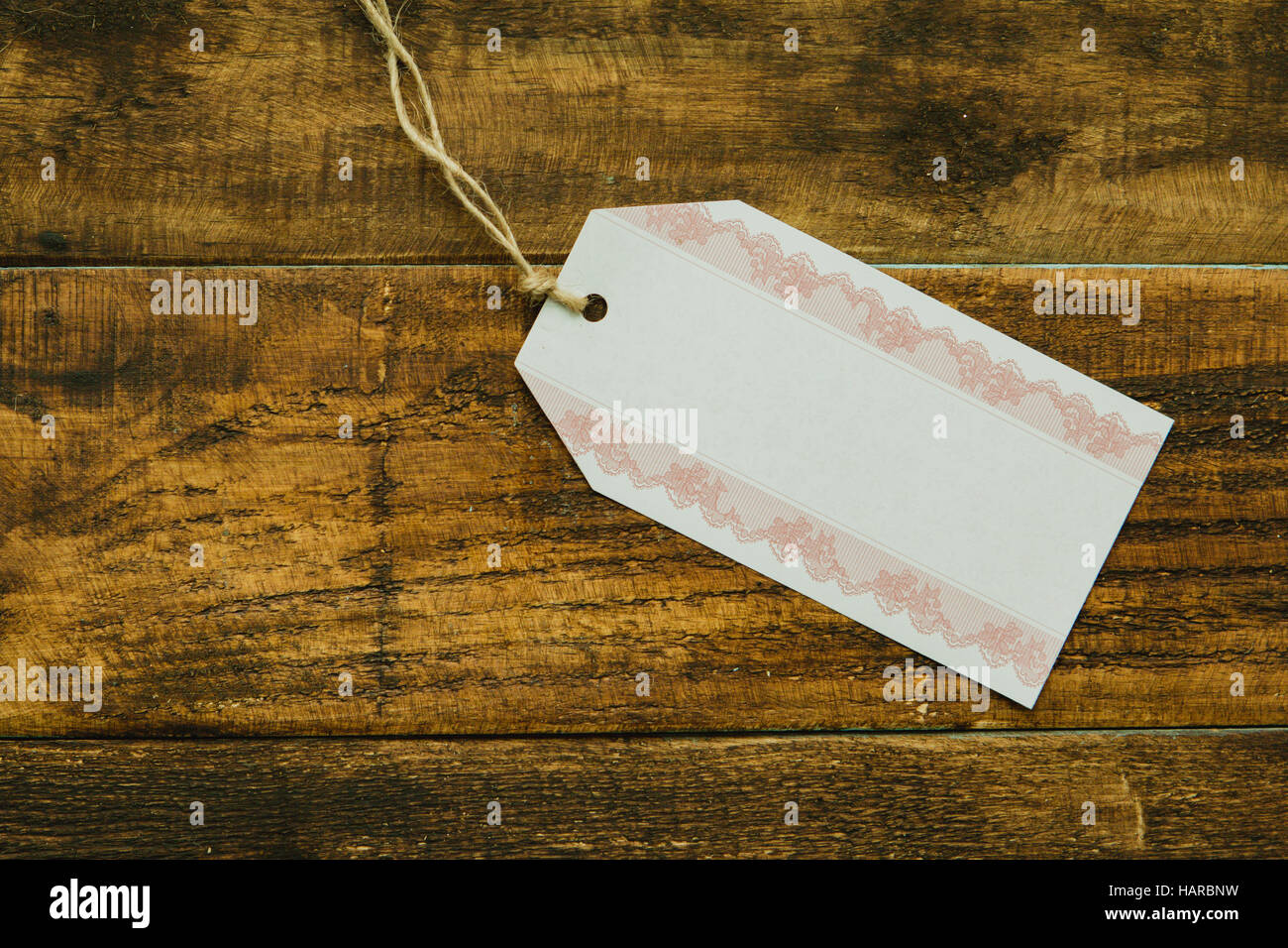 Empty shopping tag template on a rustic wood background Stock Photo - Alamy