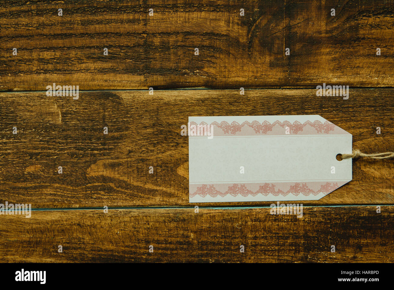 Empty shopping tag template on a rustic wood background Stock Photo - Alamy