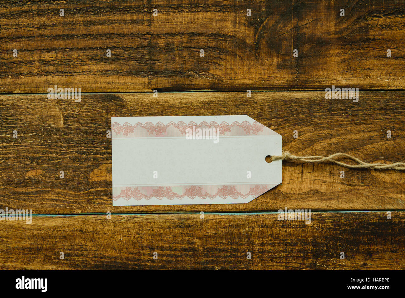 Empty shopping tag template on a rustic wood background Stock Photo - Alamy