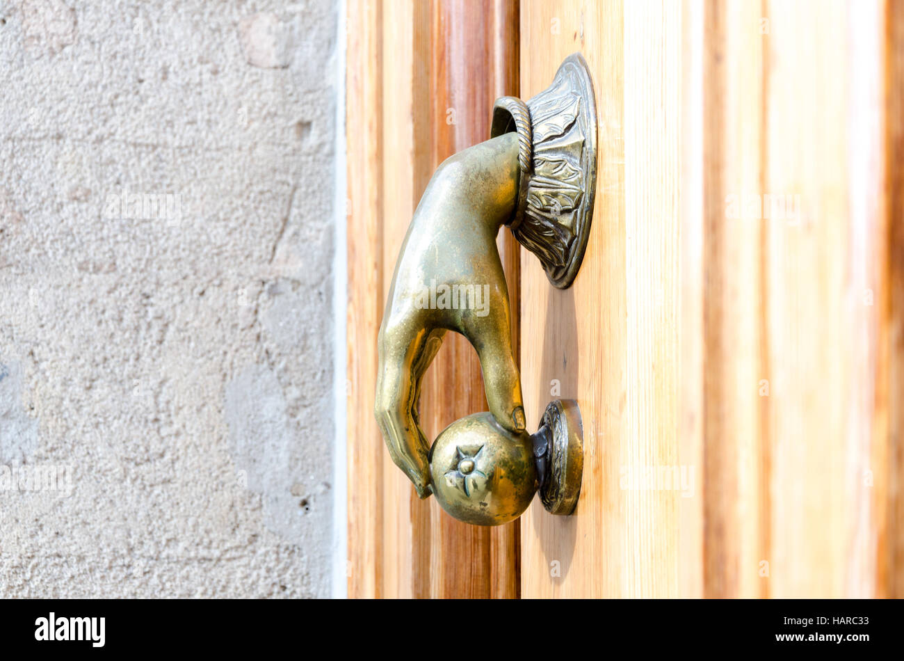WOODEN door handle in HAND FORMAT Stock Photo - Alamy