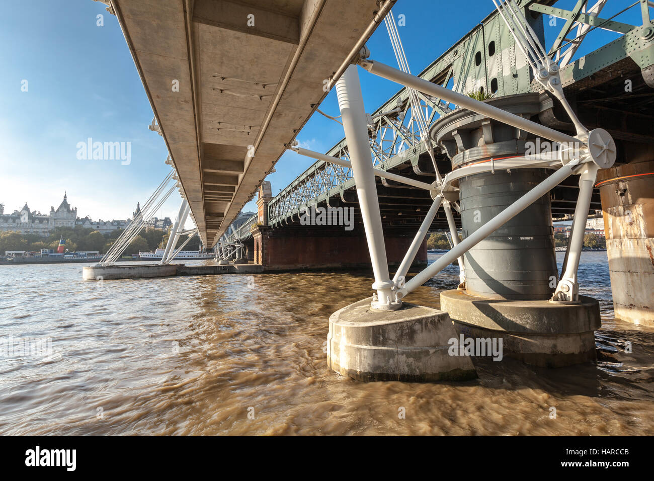 London under the Hungerford Bridge and Golden Jubilee Bridges Stock ...