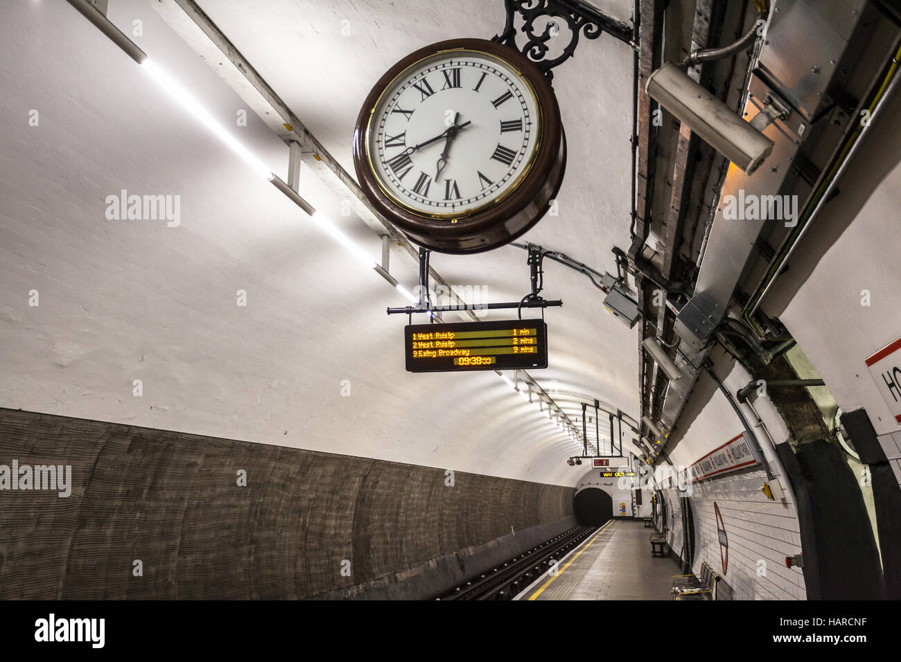 London big Clock and info panel in the underground subway station Stock ...