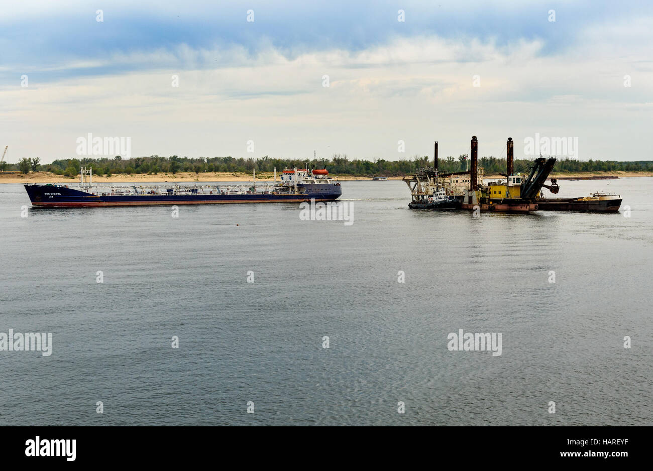 Dredging platform and cargo ship on Volga river. Volgograd, Russia ...