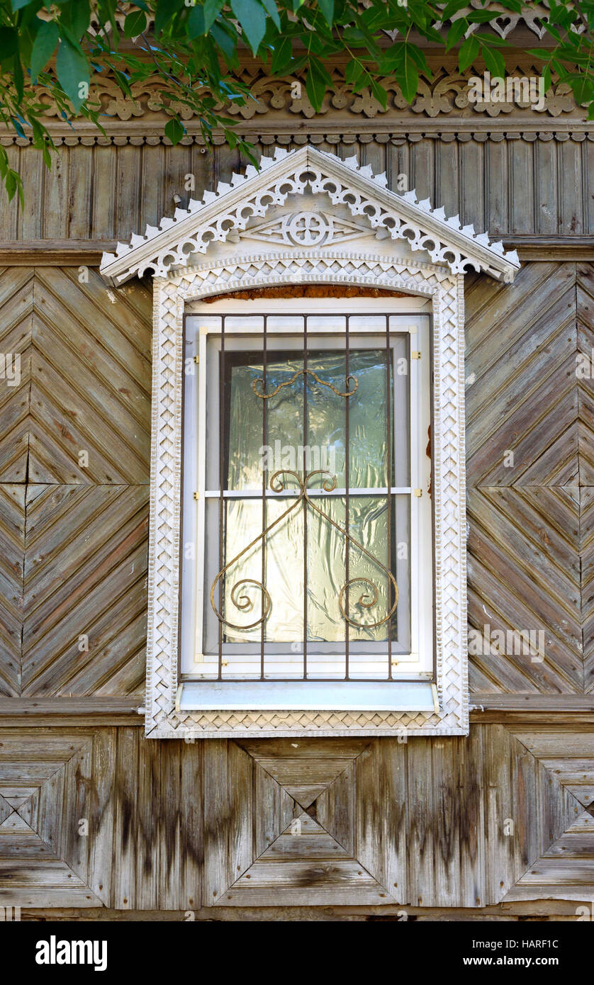 Window with carved patterns on old wooden house Stock Photo - Alamy