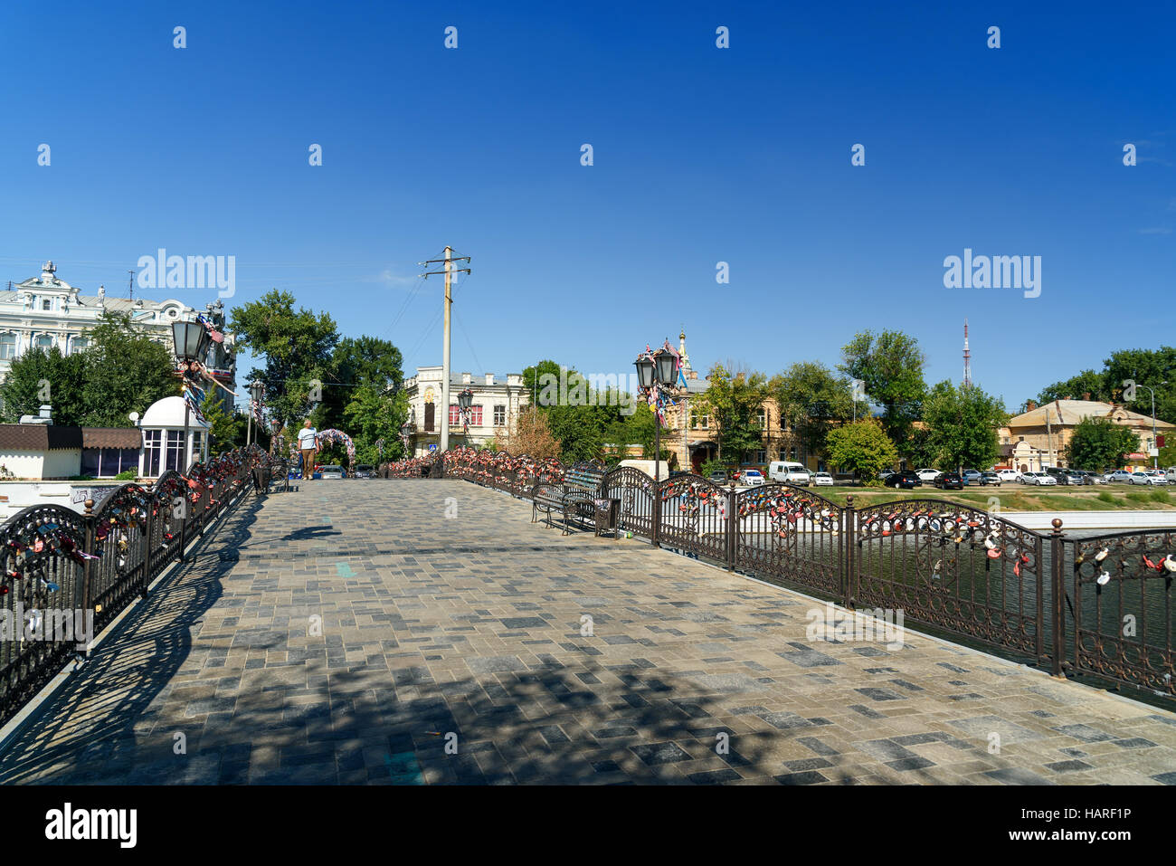 Love Bridge with a lot of colored ribbons and locks. Symbol of the ...