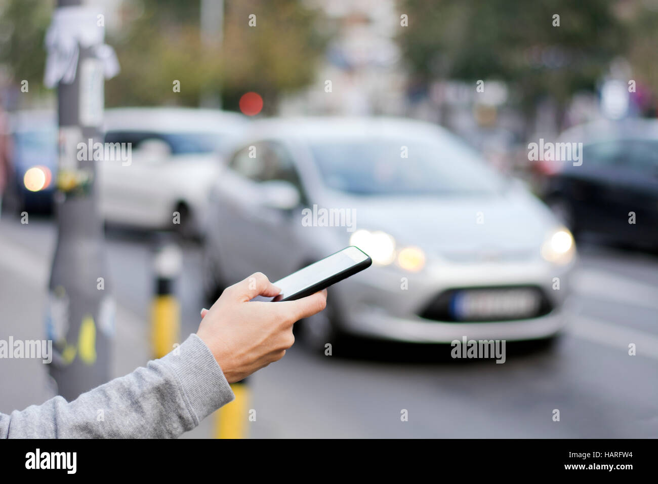 Person in crowd on phone hi-res stock photography and images - Alamy