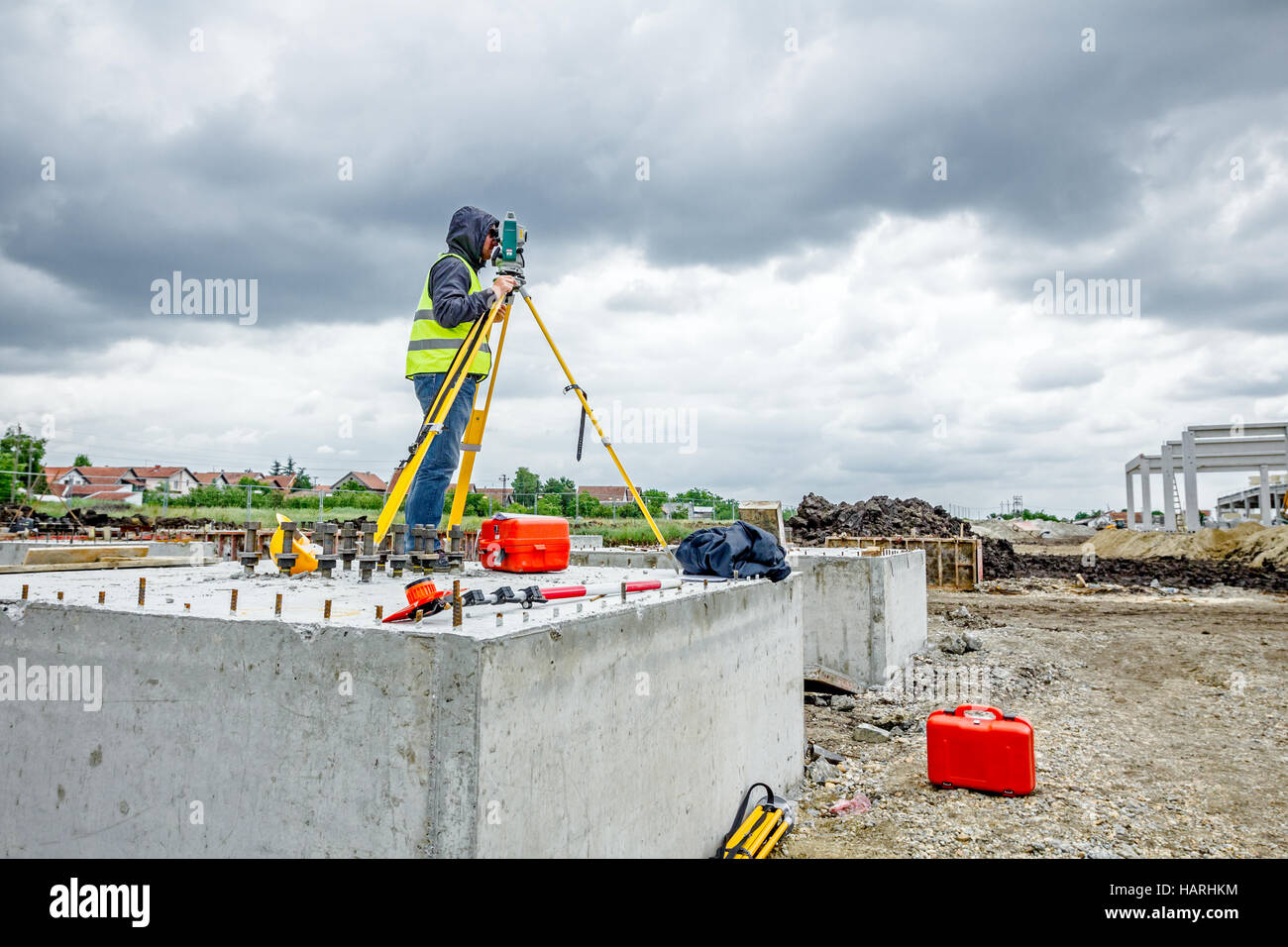 Surveyor engineer is measuring level on construction site. Surveyors ...