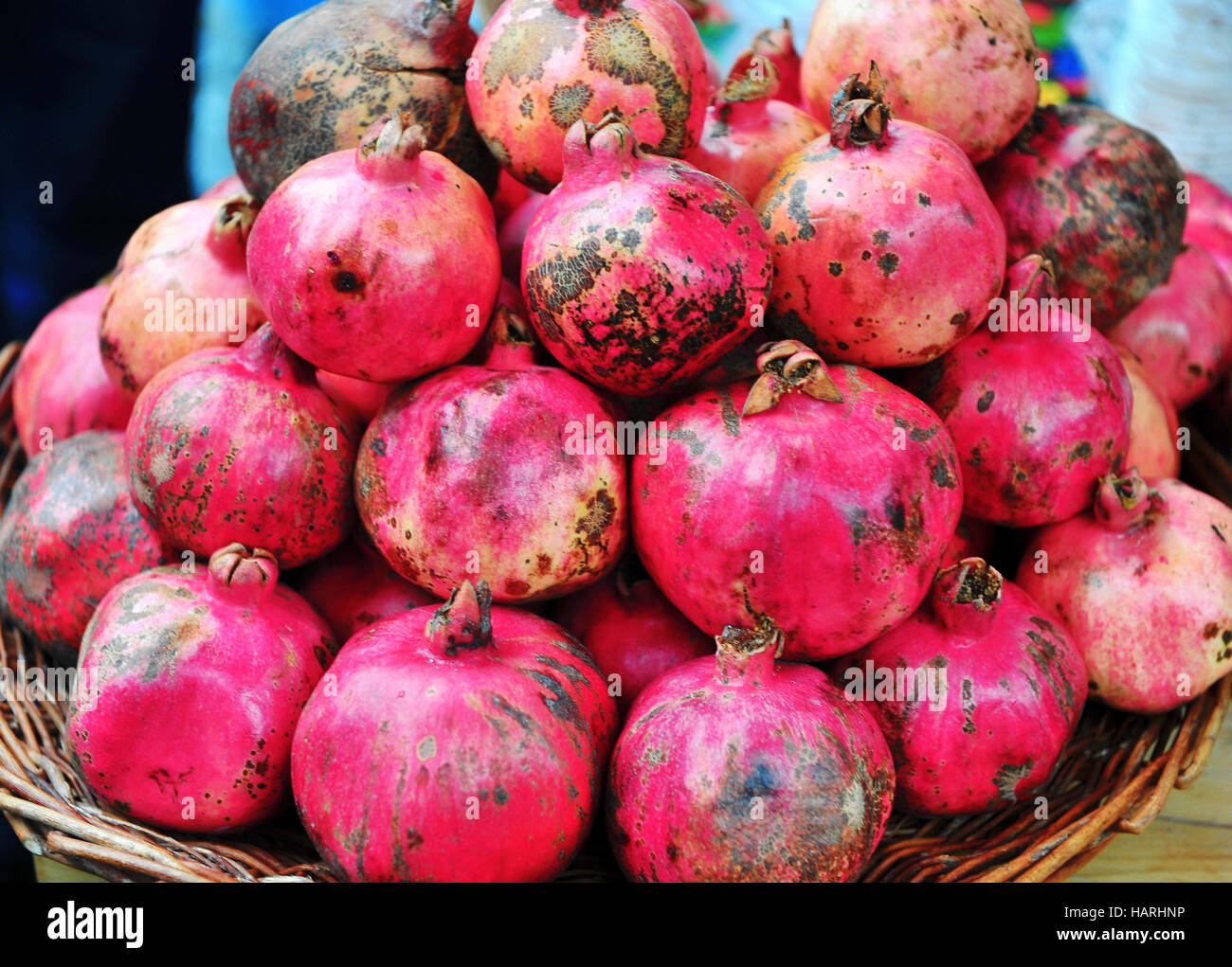 Deep red pomegranates in the food market Stock Photo - Alamy