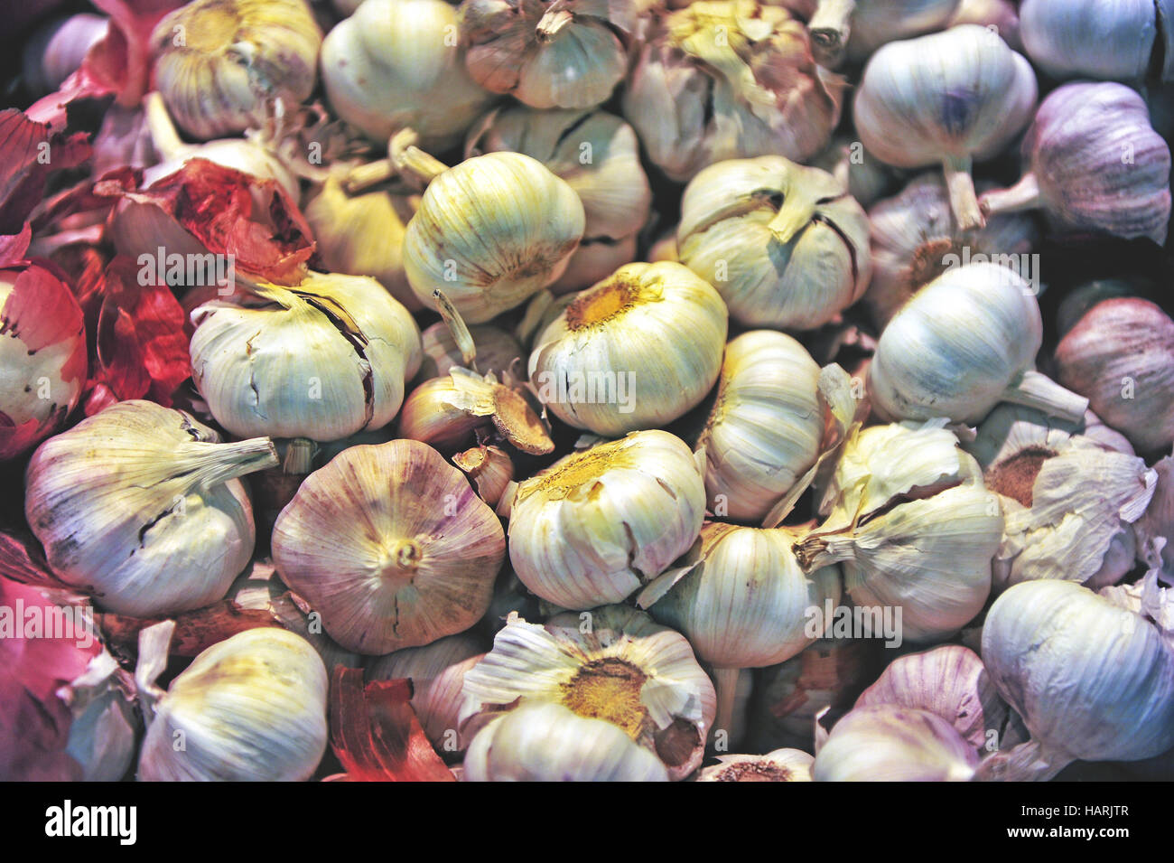Garlic in the grocery store background Stock Photo - Alamy