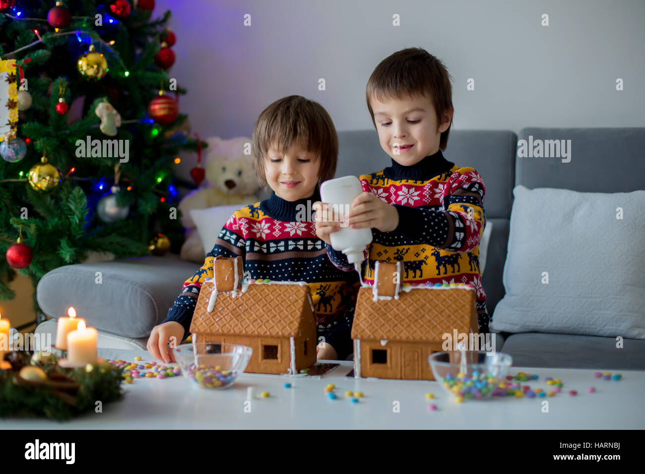 Children making gingerbread house hi-res stock photography and images ...