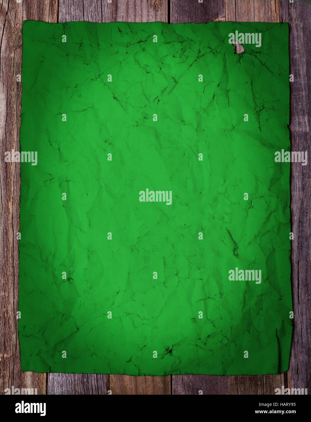 Blank page of old green vintage paper on wooden background Stock Photo ...
