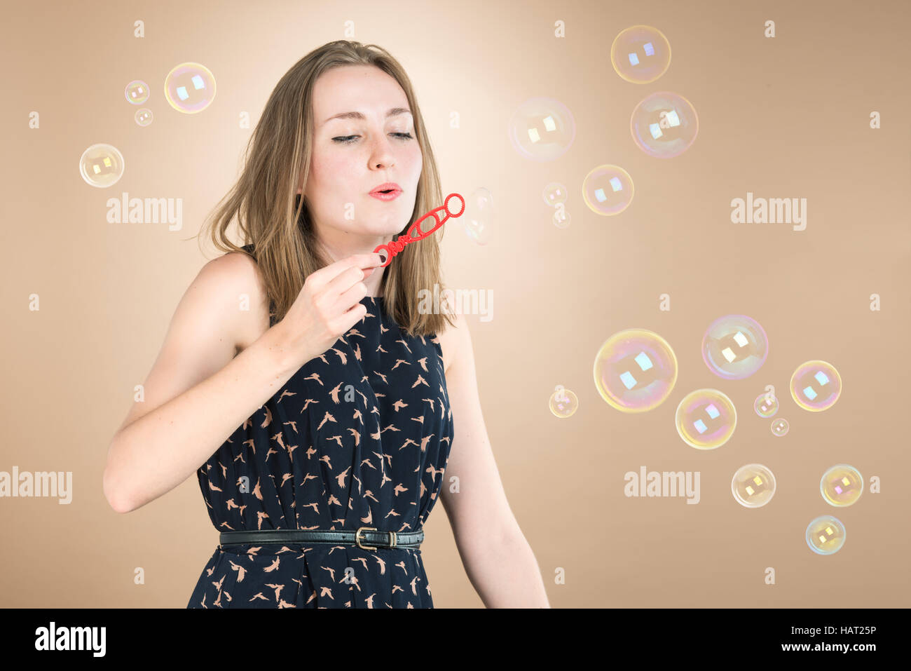 Woman blowing bubbles hi-res stock photography and images - Alamy