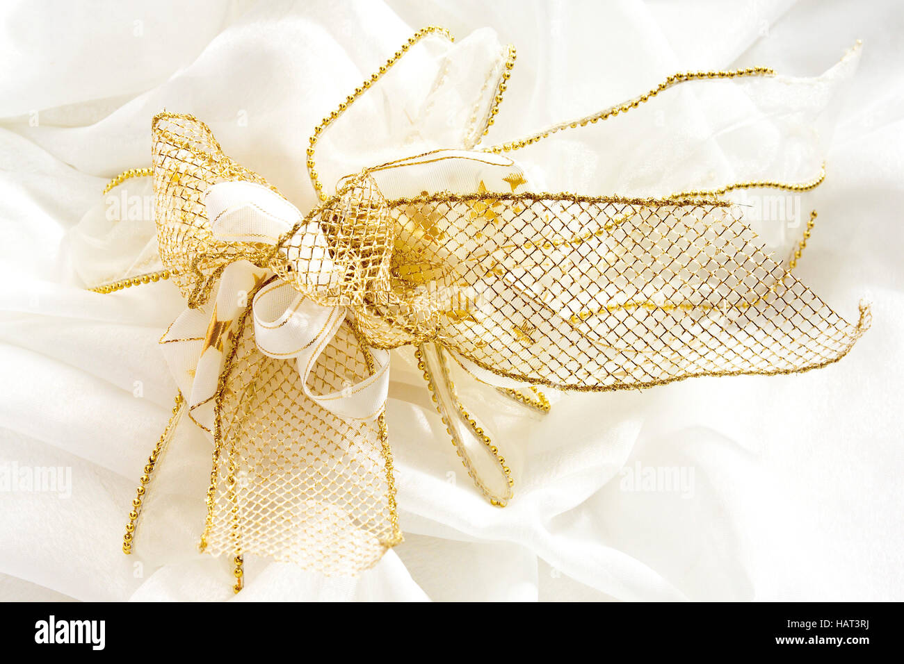 White and gold ribbon Stock Photo - Alamy