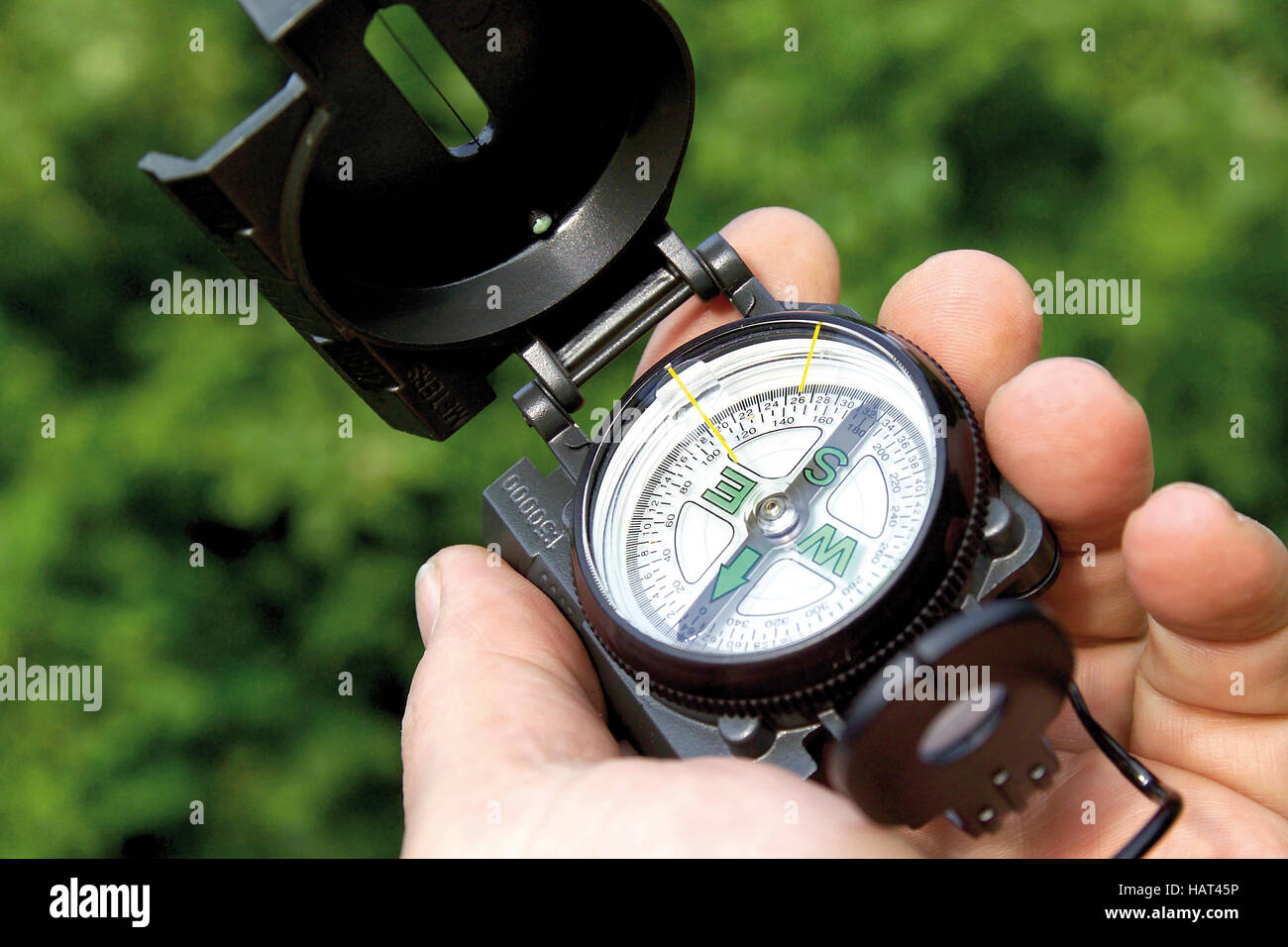 Hand holding a compass Stock Photo - Alamy