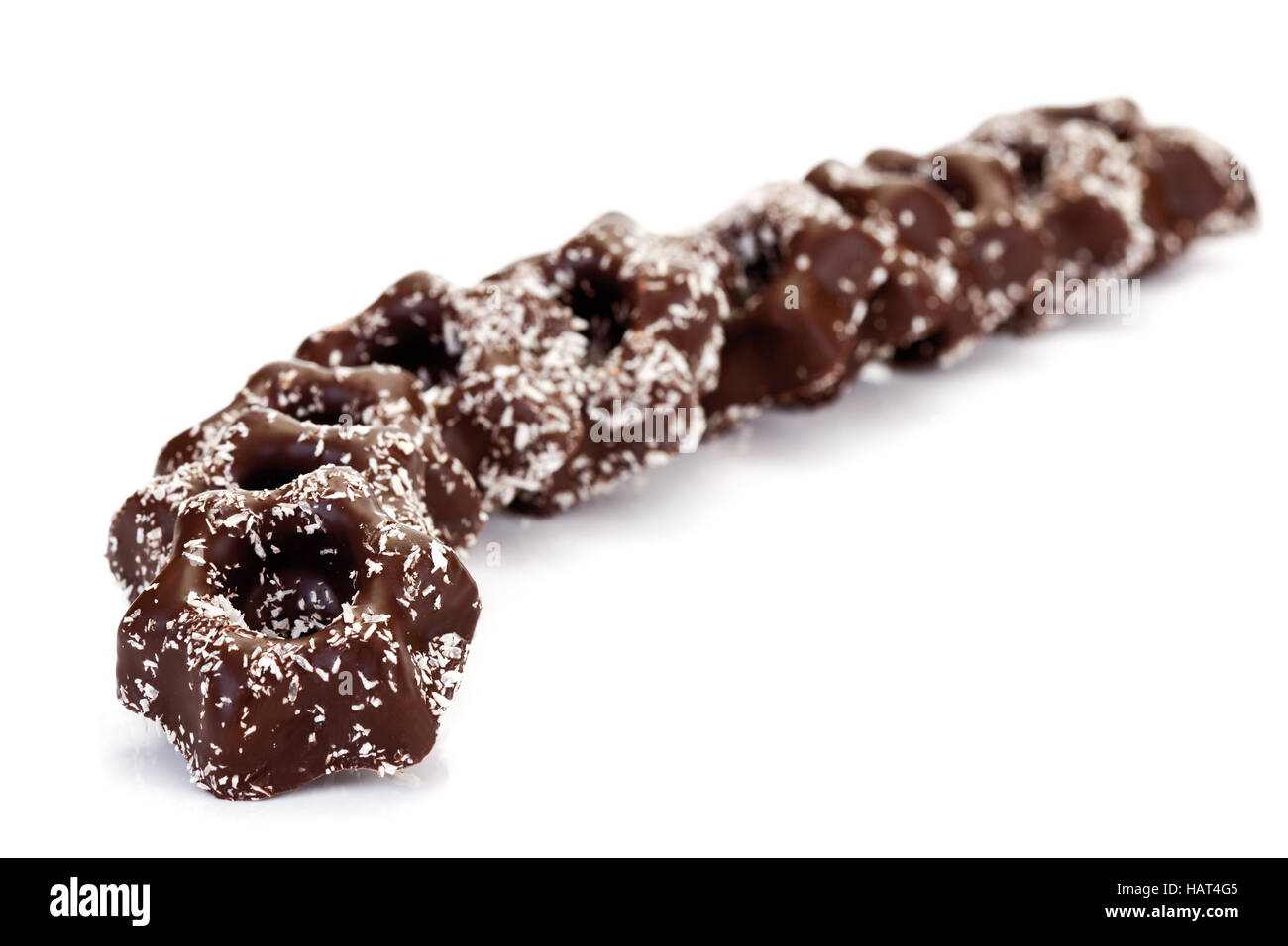 Coconut star candies coated in chocolate Stock Photo - Alamy