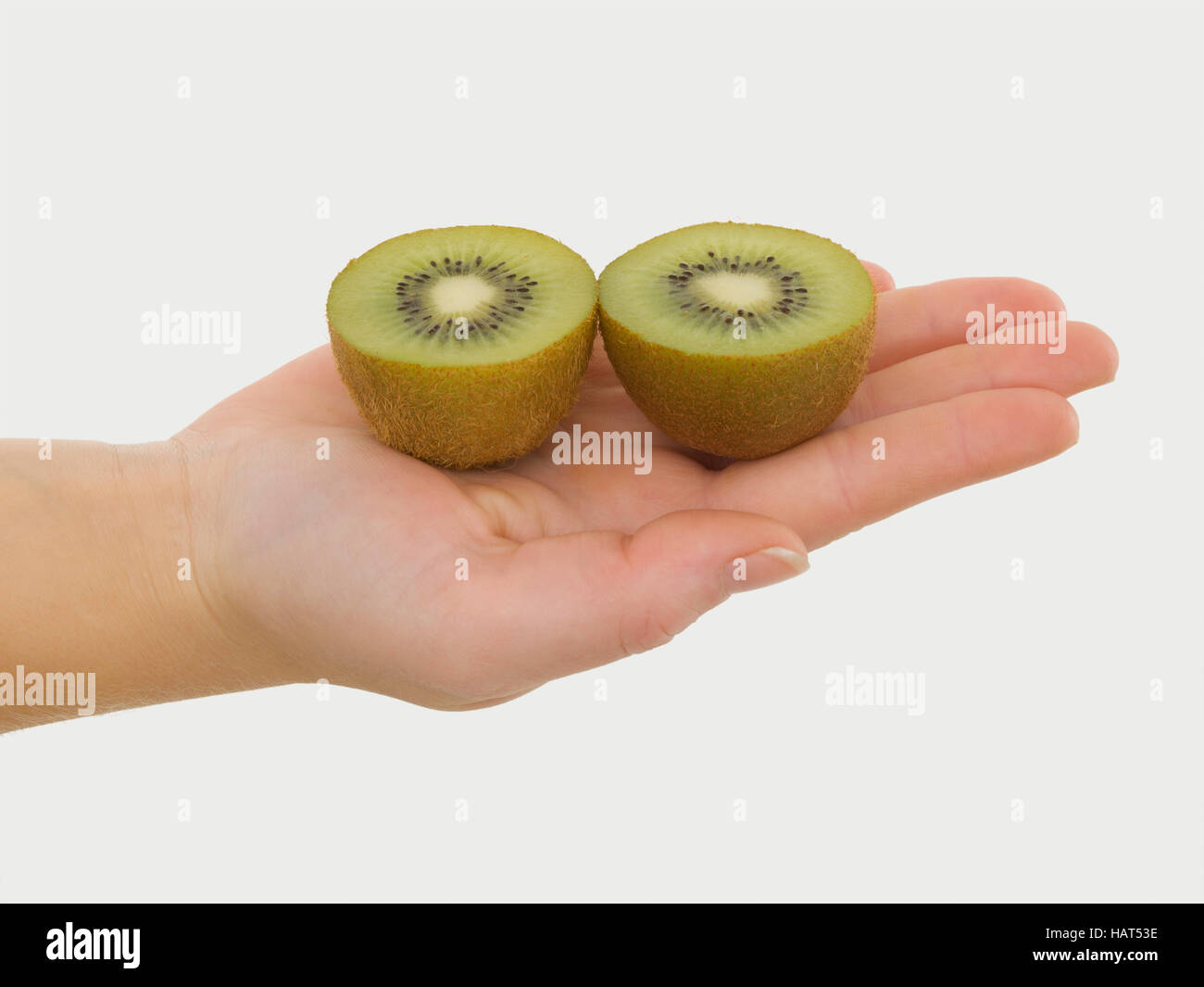 Kiwi fruit on a hand Stock Photo - Alamy