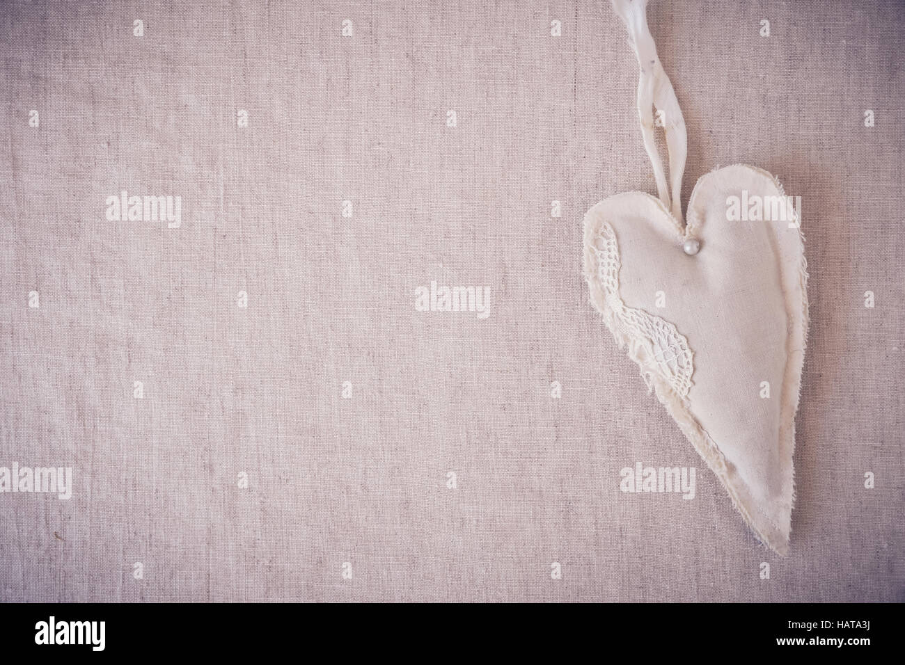 vintage linen heart on toning background Stock Photo - Alamy