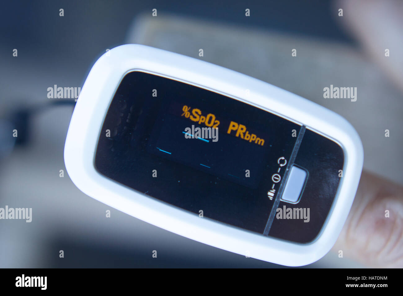 Portable hand held domestic cardiac finger pulse rate meter to show ...