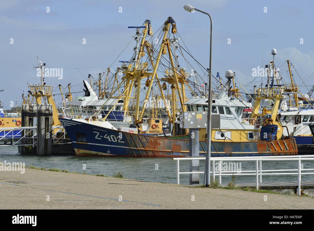Heavy rusty fishing vessel with a blue painting in the basin of ...