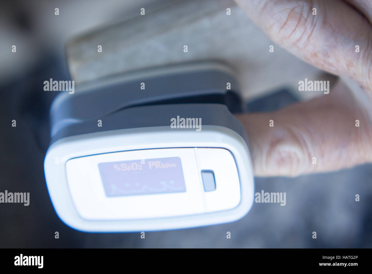 Portable hand held domestic cardiac finger pulse rate meter to show ...