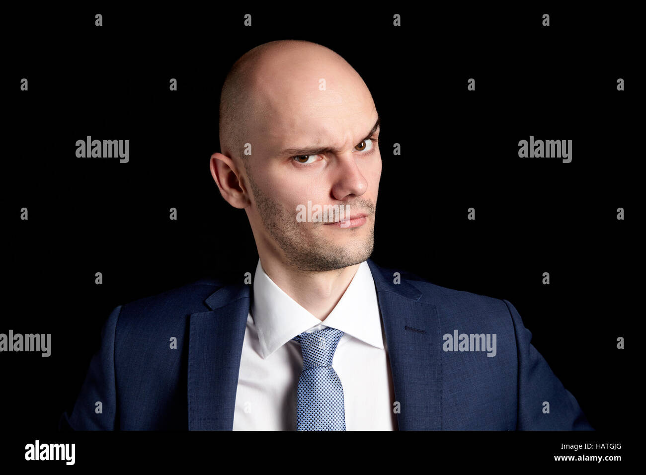 Studio portrait of a young unhappy businessman Stock Photo - Alamy
