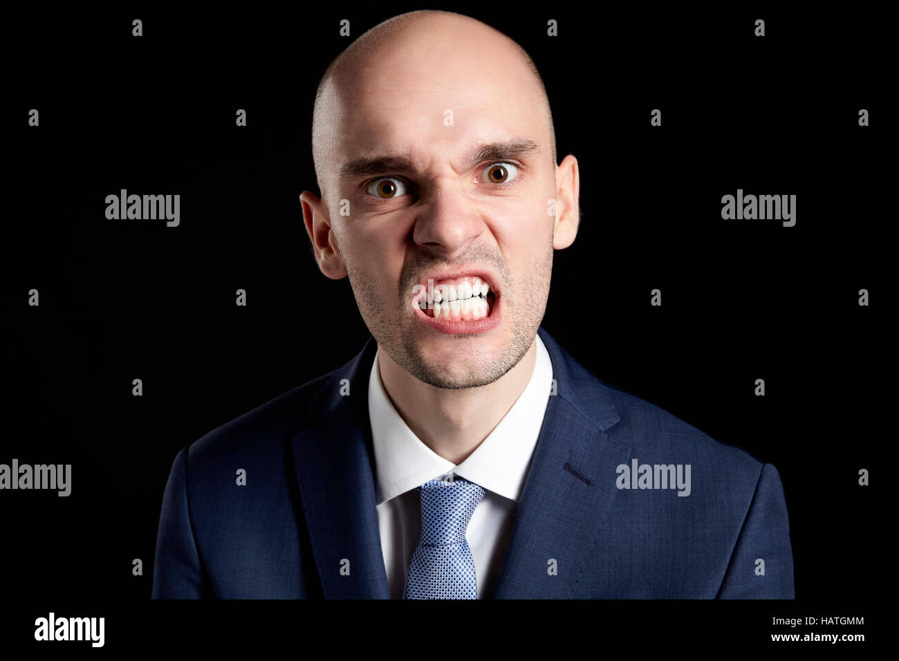 Portrait of Young Angry Guy against Black Background Stock Photo - Alamy