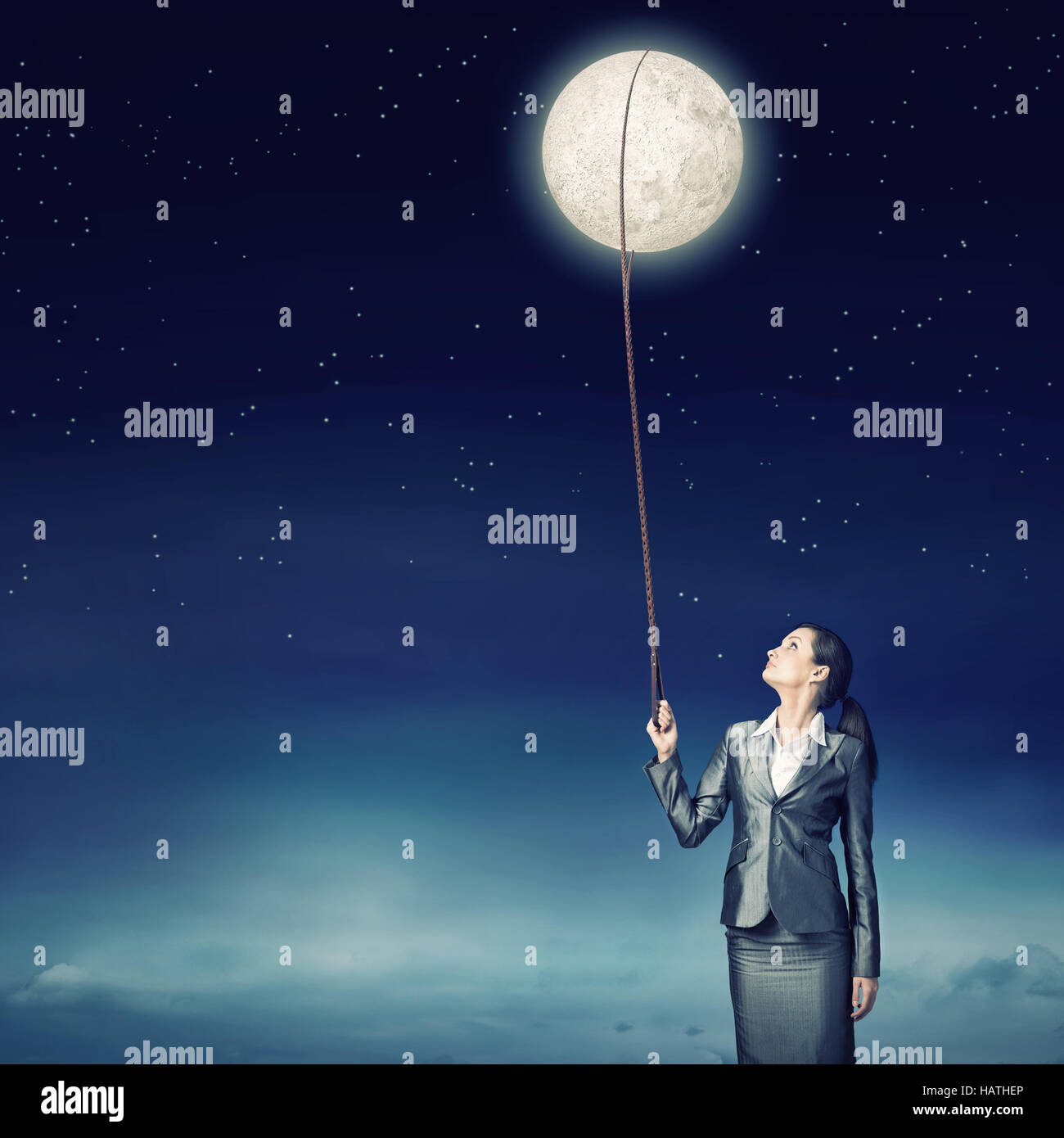 Woman catch moon Stock Photo - Alamy
