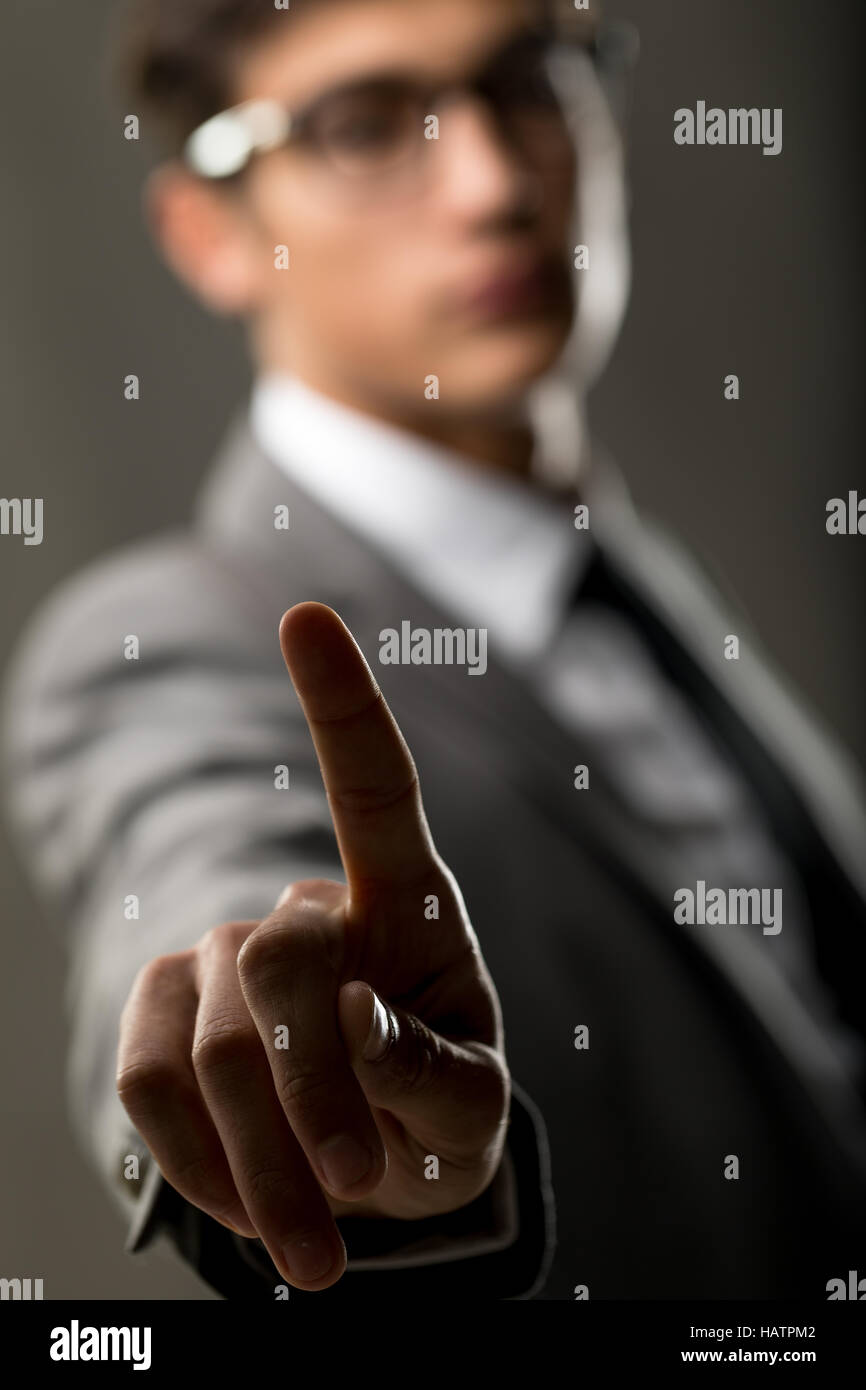 Businessman warning index finger hi-res stock photography and images ...