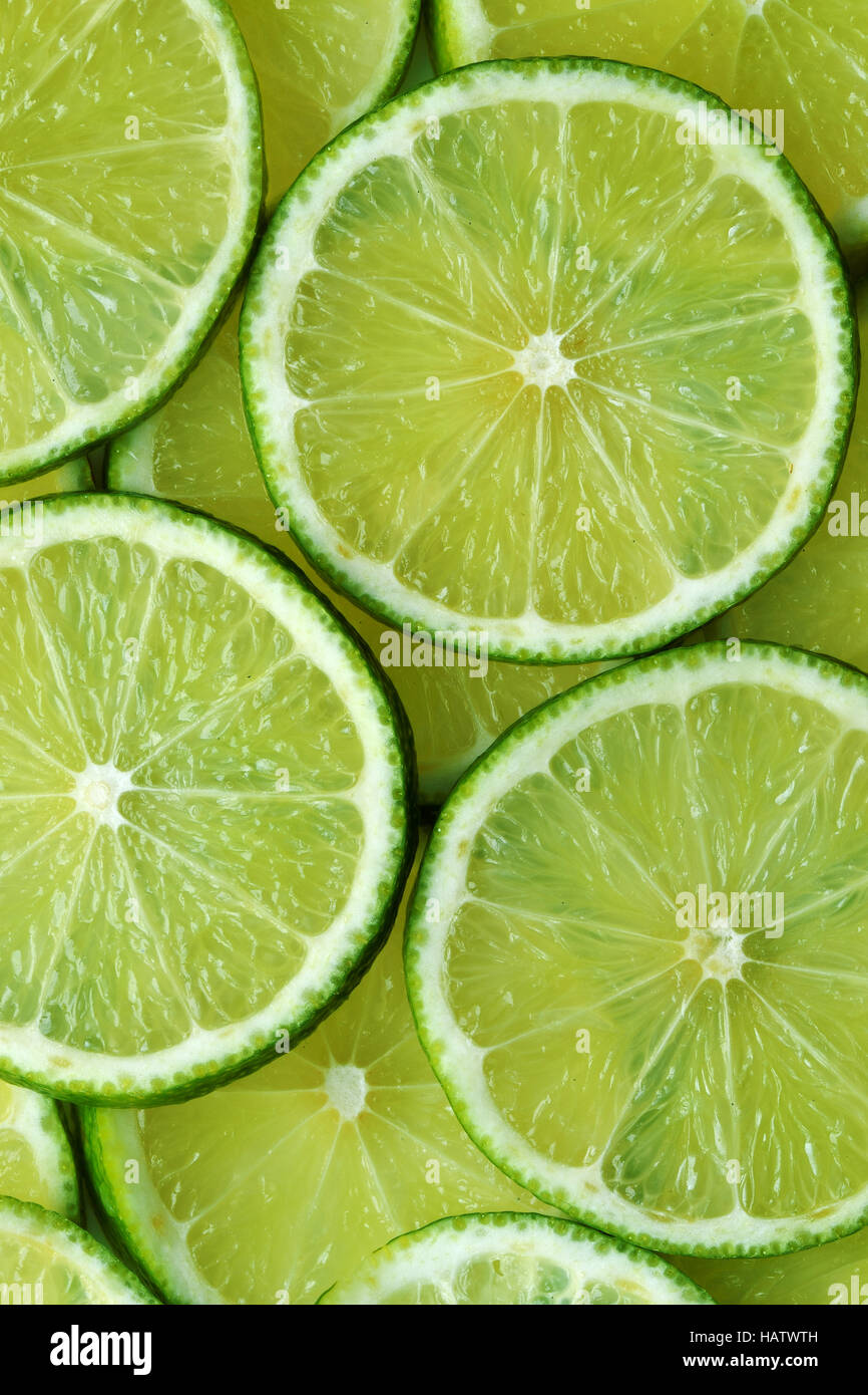 Lime slices background Stock Photo - Alamy