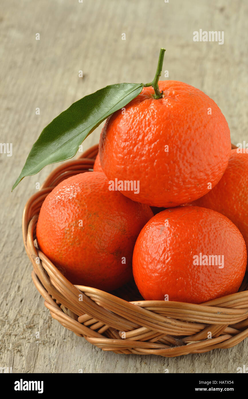 Mandarin in a wicker basket Stock Photo - Alamy