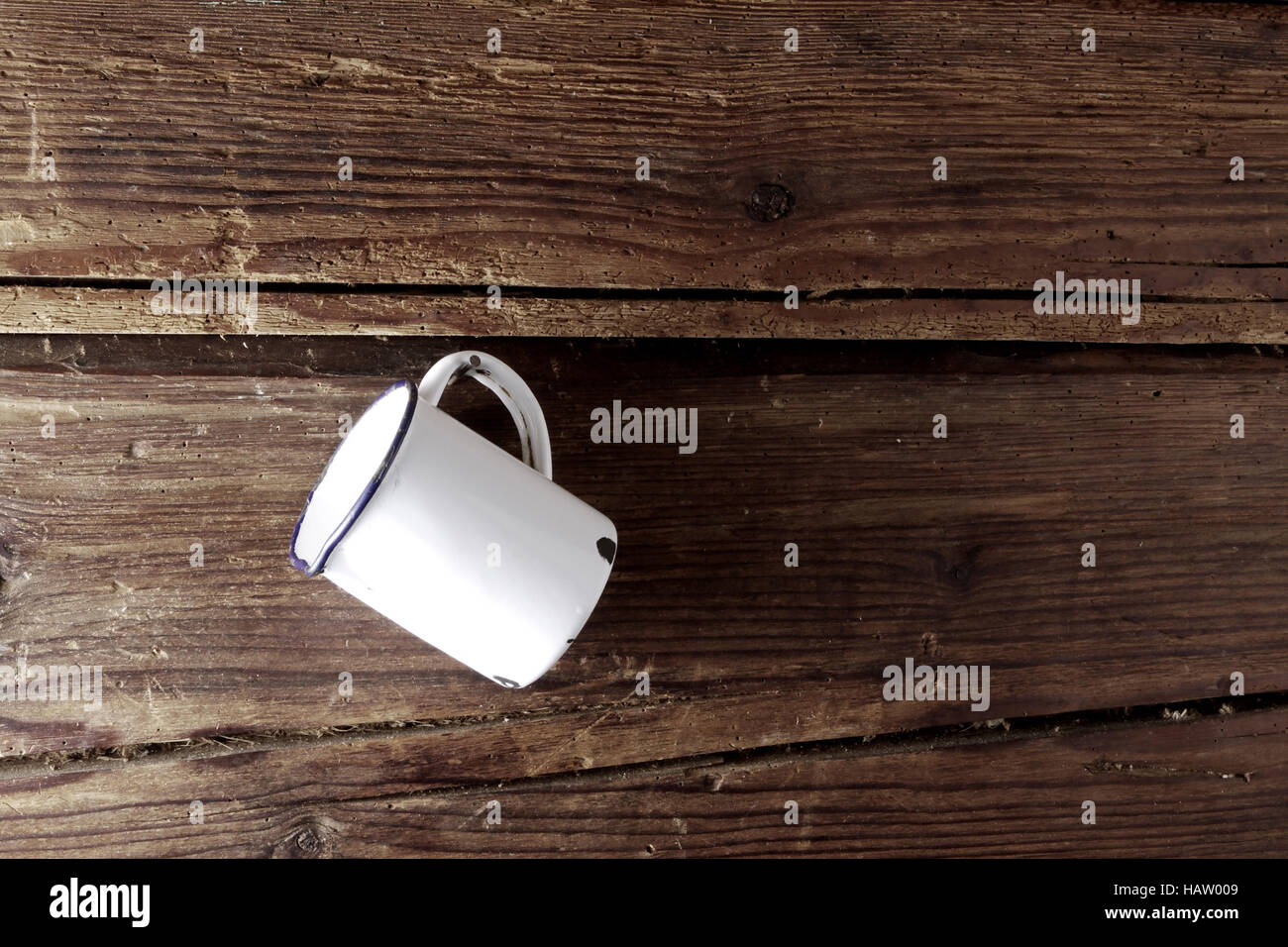 old cup hanging on a wooden wall Stock Photo - Alamy