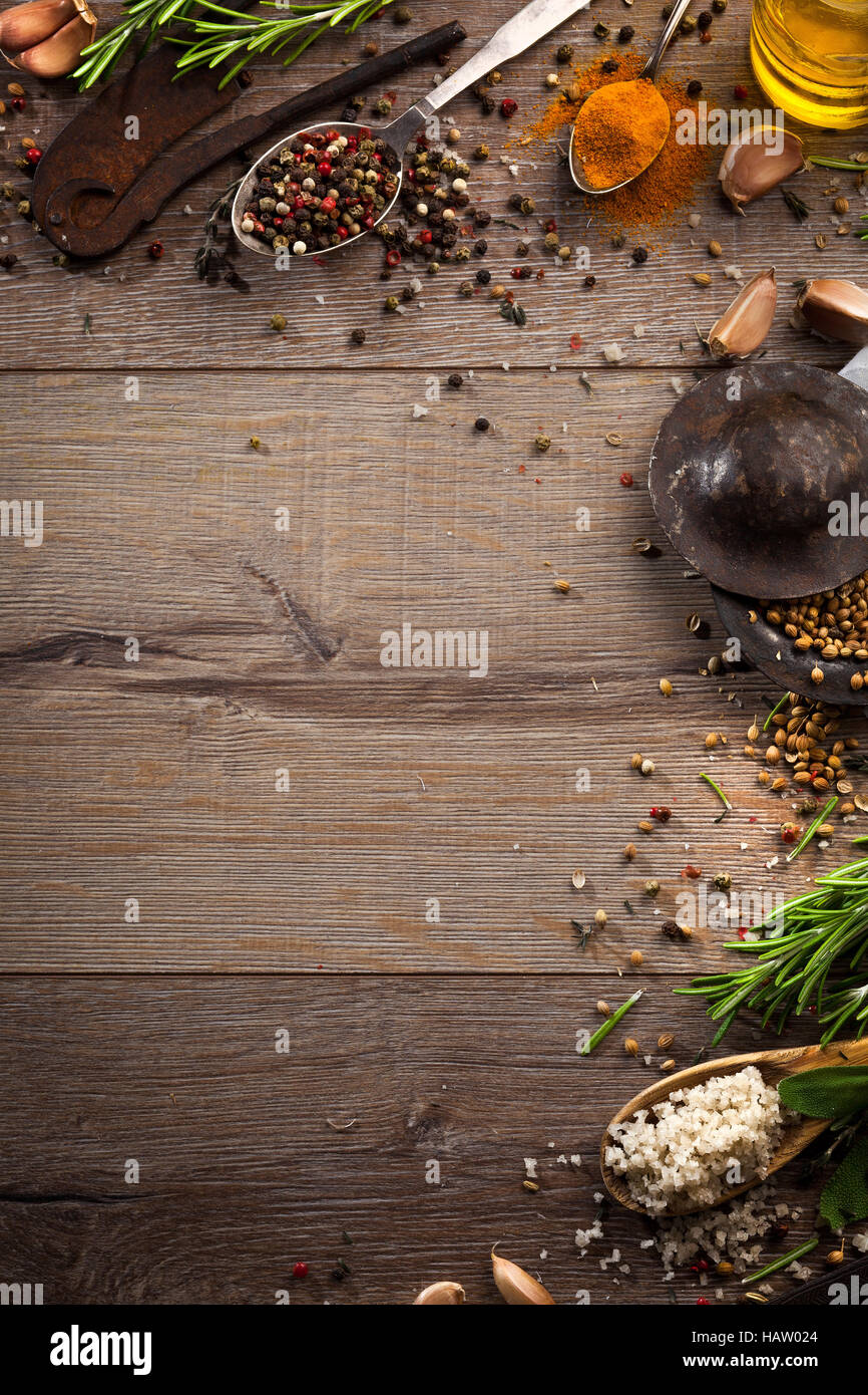 Various herbs and spices on dark wood table Stock Photo - Alamy