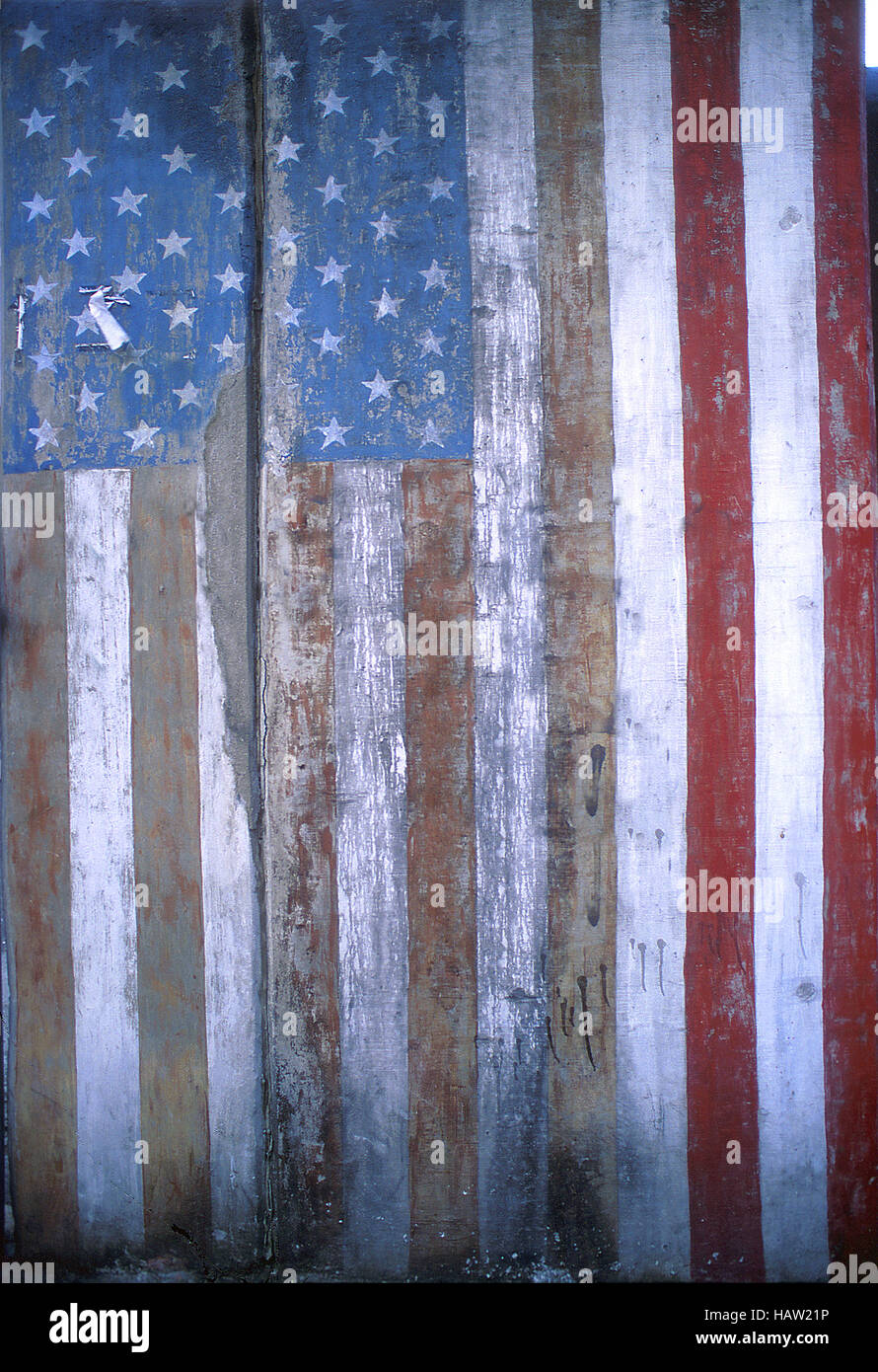 Weathered flag painting on fence in New York City Stock Photo - Alamy