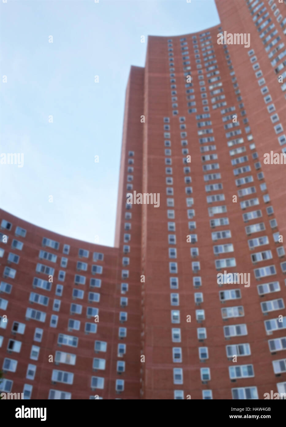 Blurred background of red brick apartment tower Stock Photo - Alamy