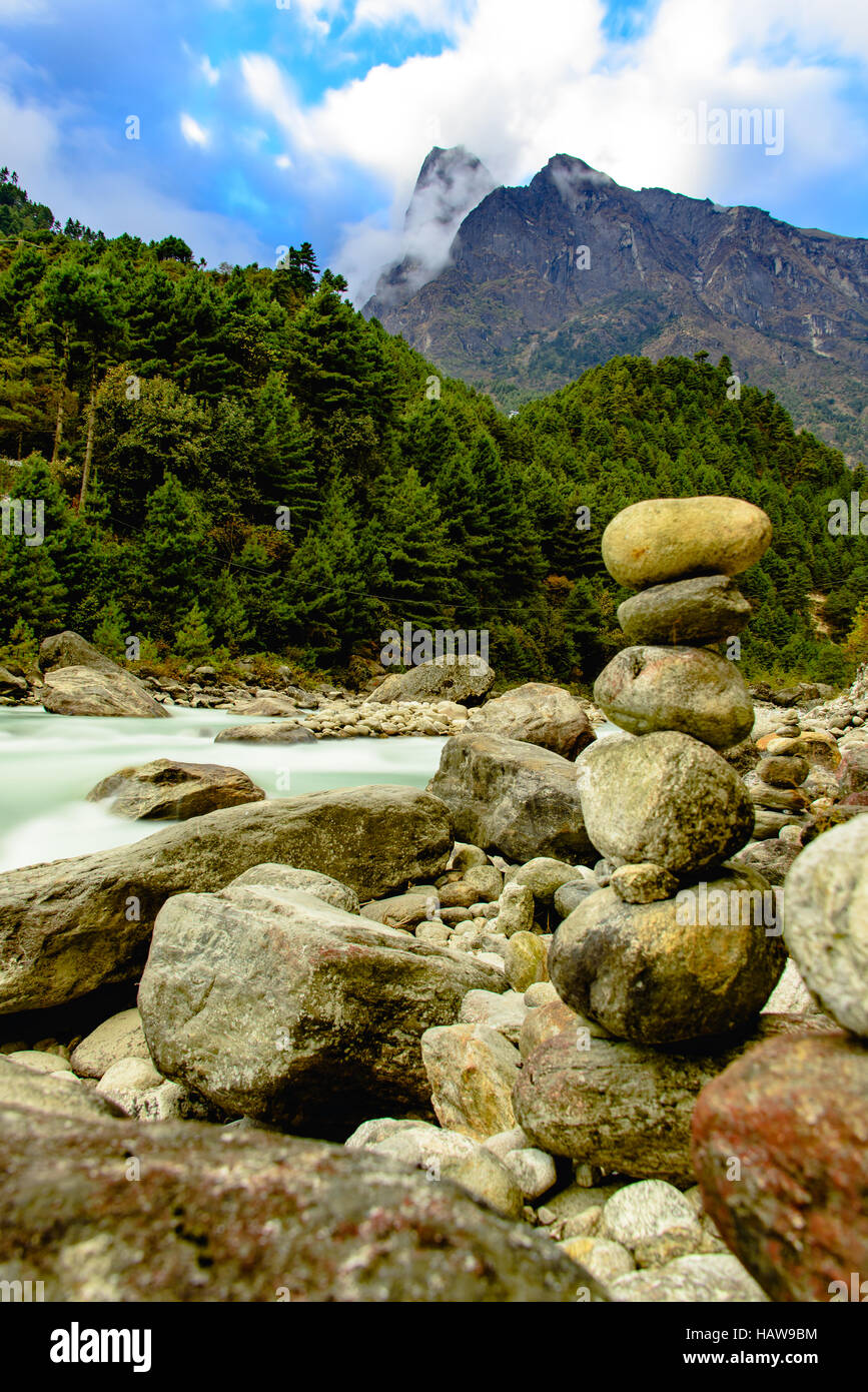 Rock pile or Cairn on side of river in Khumbu valley near Phakding ...
