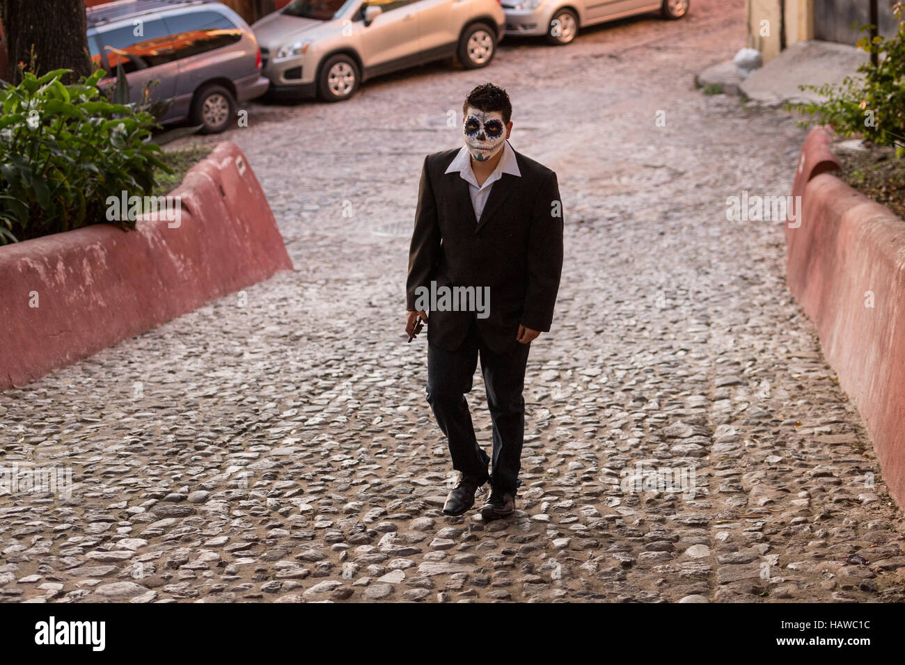 A man dressed as the dapper skeleton costume for Day of the Dead ...