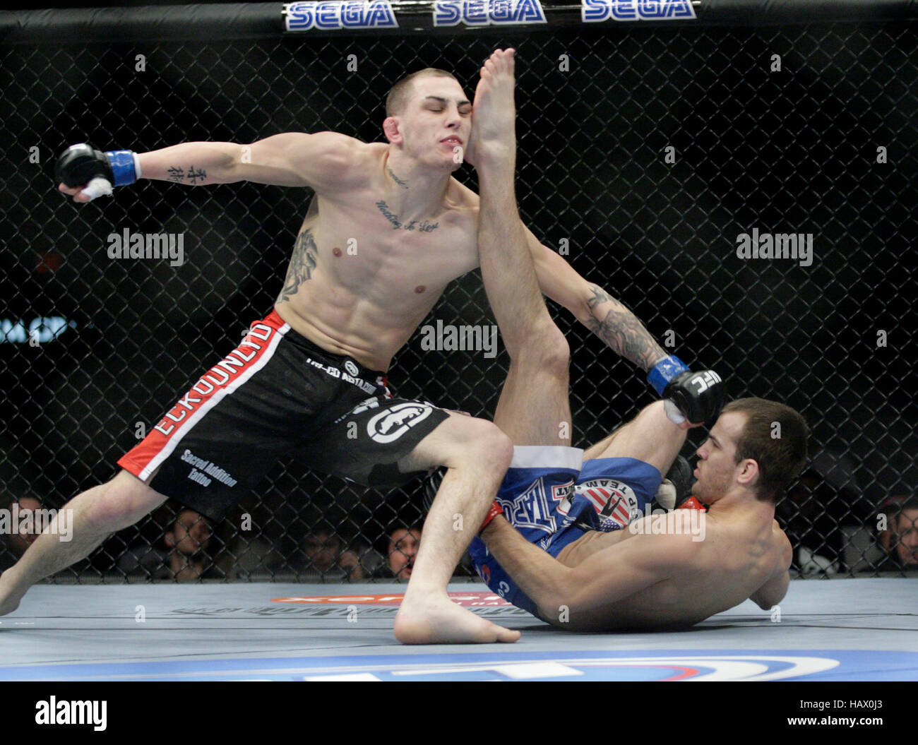 Cole Miller, blue shorts, fights Dan Lauzon, red and black shorts ...